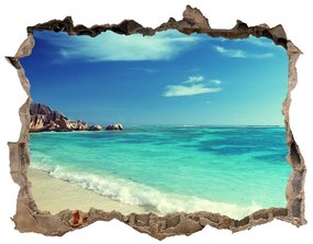 Wallmuralia Díra 3D ve zdi nálepka Seychely pláž 95x64 cm