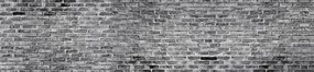 DIMEX | Fototapeta do kuchyně Šedá cihlová zeď KI-260-300 | 260 x 60 cm | šedá, černá