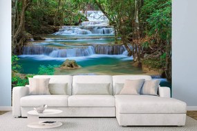 DIMEX | Samolepicí vliesová fototapeta na zeď Kaskádový vodopád v lese MA-5-3250 | 375 x 250 cm | zelená, modrá, bílá, hnědá
