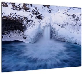 Skleněný obraz vodopádu v zimě (70x50 cm)
