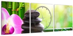 Obraz masážních kamenů a orchidee na vodě (s hodinami) (90x30 cm)
