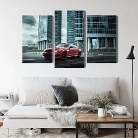 Vícedílný obraz Červené Auto Na Pozadí Moderních Mrakodrapů Nedostatek Nedostatek Přírodní plátno 150x100