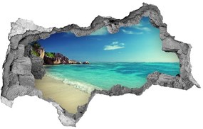 Wallmuralia Díra 3D ve zdi nálepka Seychely pláž 95x73 cm