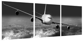 Černobílý obraz letadla v oblacích (90x30 cm)