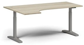 Výškově nastavitelný stůl, elektrický, 675-1325 mm, rohový levý, deska 1800x1200 mm, šedá podnož, dub přírodní