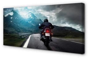 Obrazy na plátně Motocyklu horské silnici muž nebe 140x70 cm