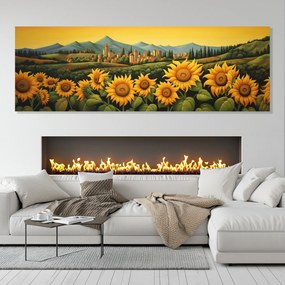Obraz na plátně - Slunečnicové pole s vesničkou v kopcích FeelHappy.cz Velikost obrazu: 90 x 30 cm