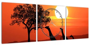 Obraz žiraf při západu slunce (s hodinami) (90x30 cm)