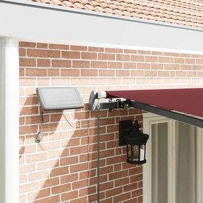 Ručně zatahovací markýza s LED světly burgundská 600 x 300 cm 3310200